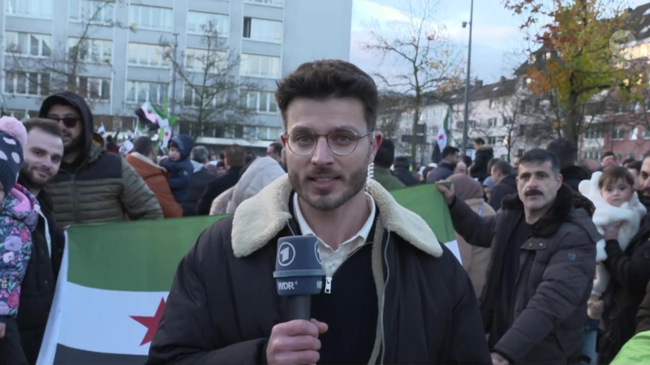 "Hier sind schätzungsweise 800 bis 1200 Menschen", Borhan Akid, WDR, zu ...